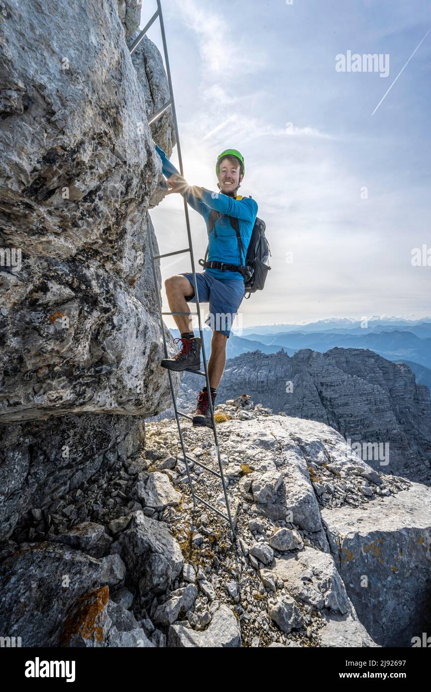 Person climbing ladder to a star hi-res stock photography and images ...