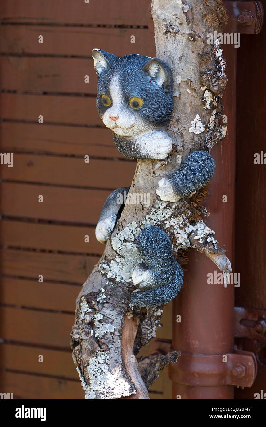 Cat figure on a tree in a garden, Bavaria, Germany Stock Photo - Alamy