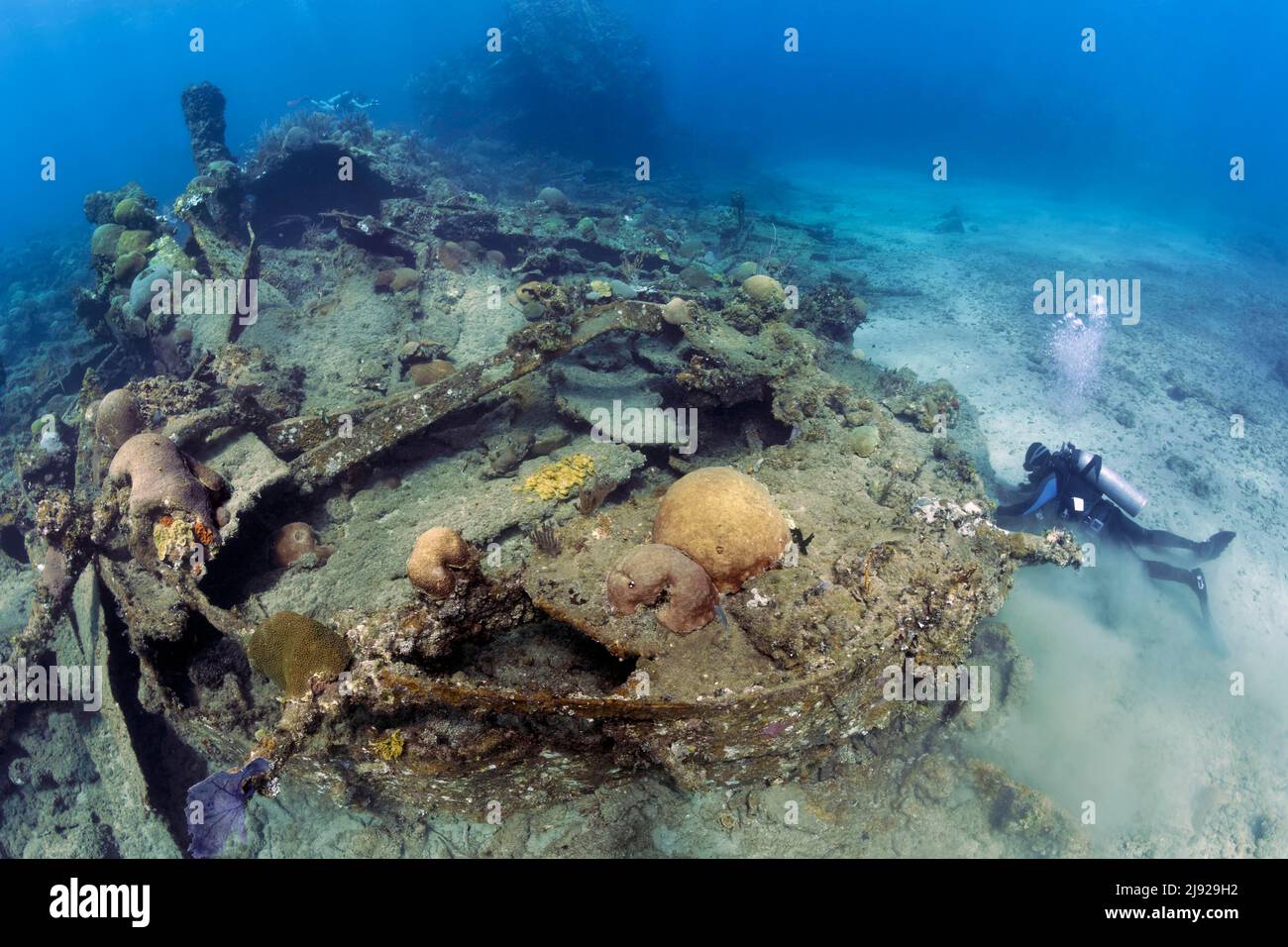 Diver explores shipwreck, wreck on sandy bottom, Spanish armoured ...