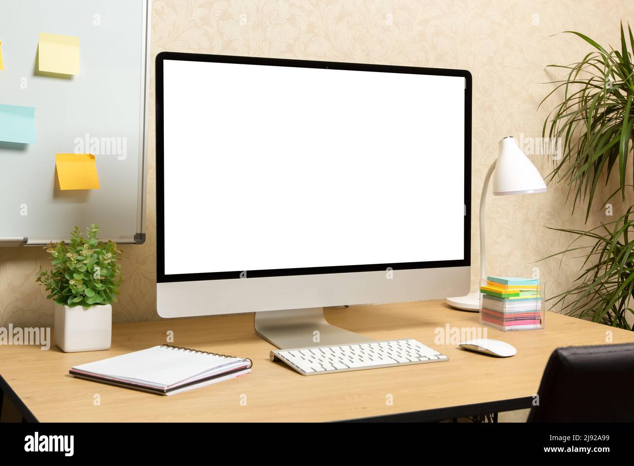 Modern computer with white screen on desktop Stock Photo - Alamy