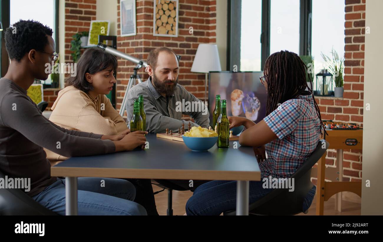 Friends having fun playing chess hi-res stock photography and images ...