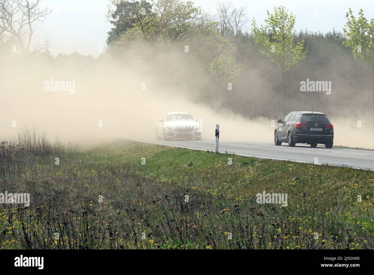 Dust cloud created by car hi-res stock photography and images - Alamy