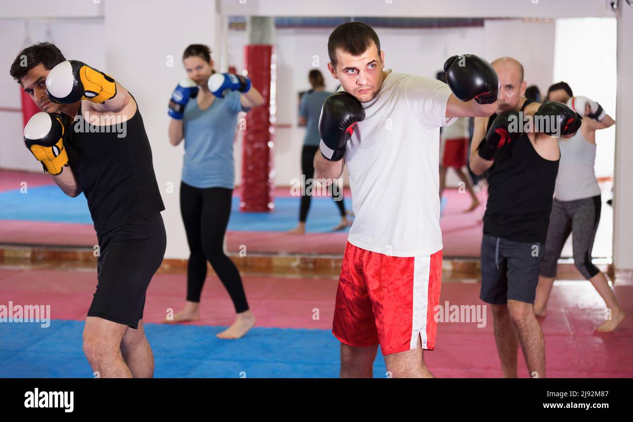 Group of adults different ages training Stock Photo - Alamy