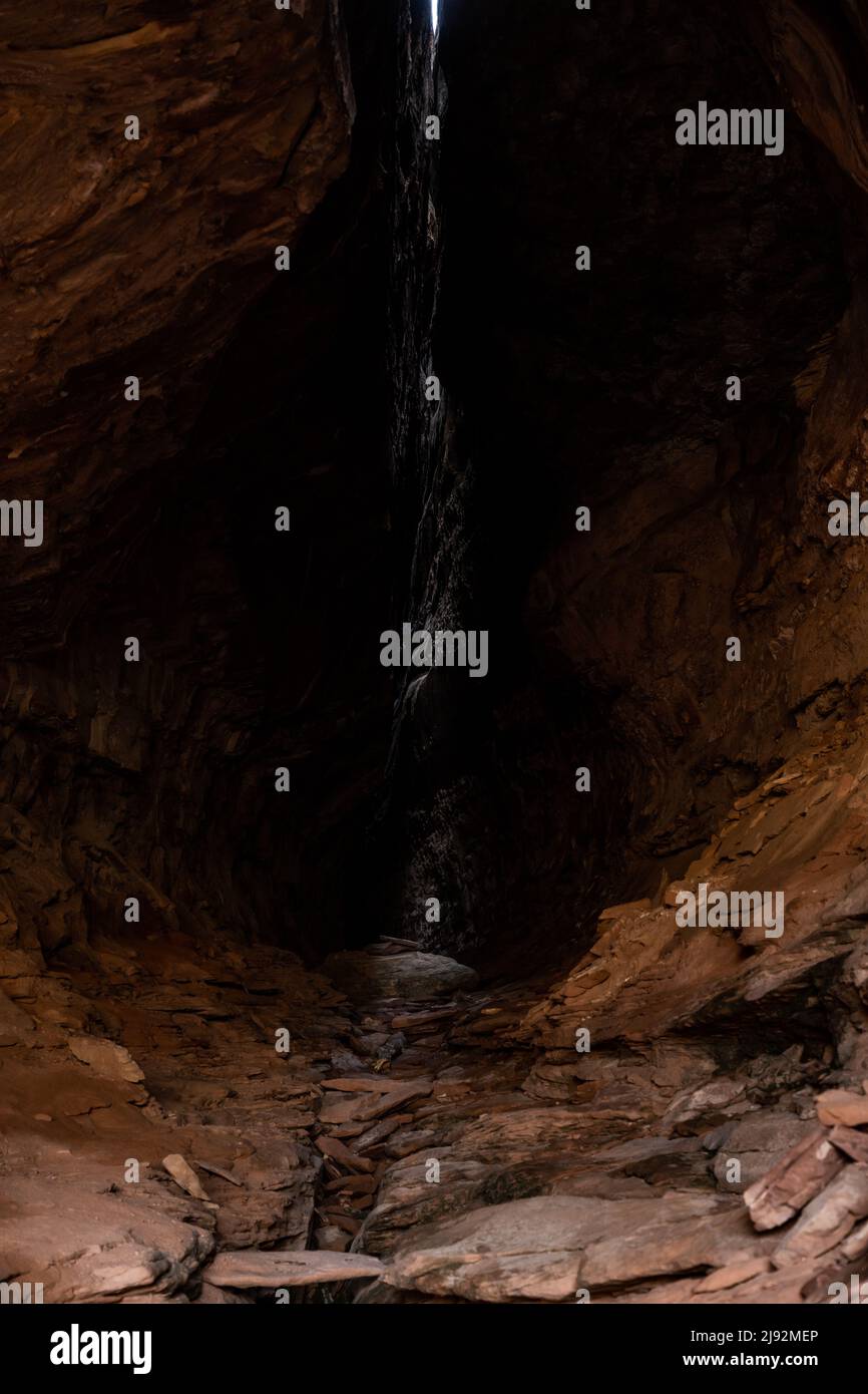 Shaft Of Light Breaks Through A Narrow Crack Of A Cave Ceiling in ...