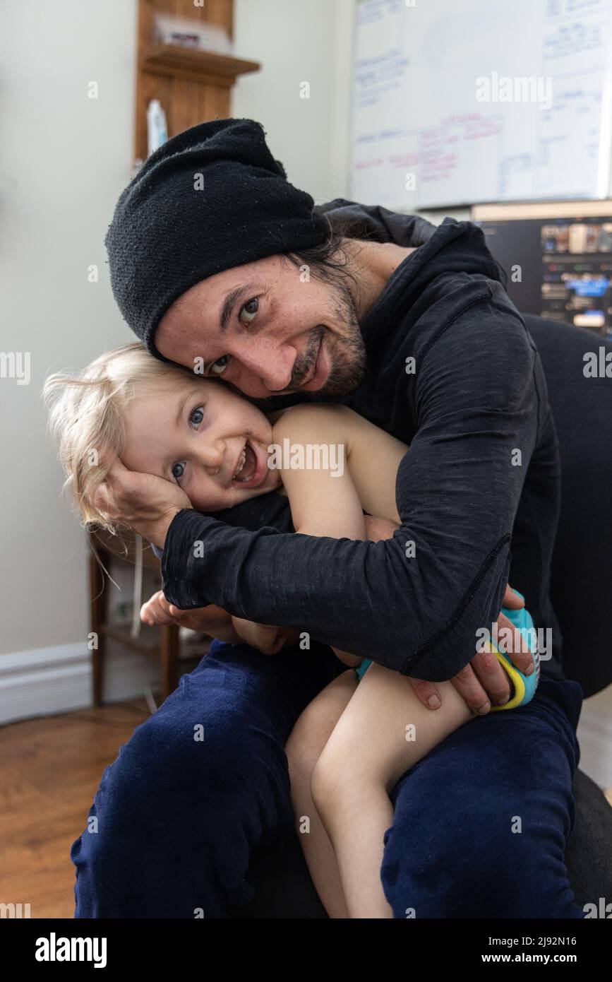 Happy portrait of thirty year old father with three year old son. Dad ...