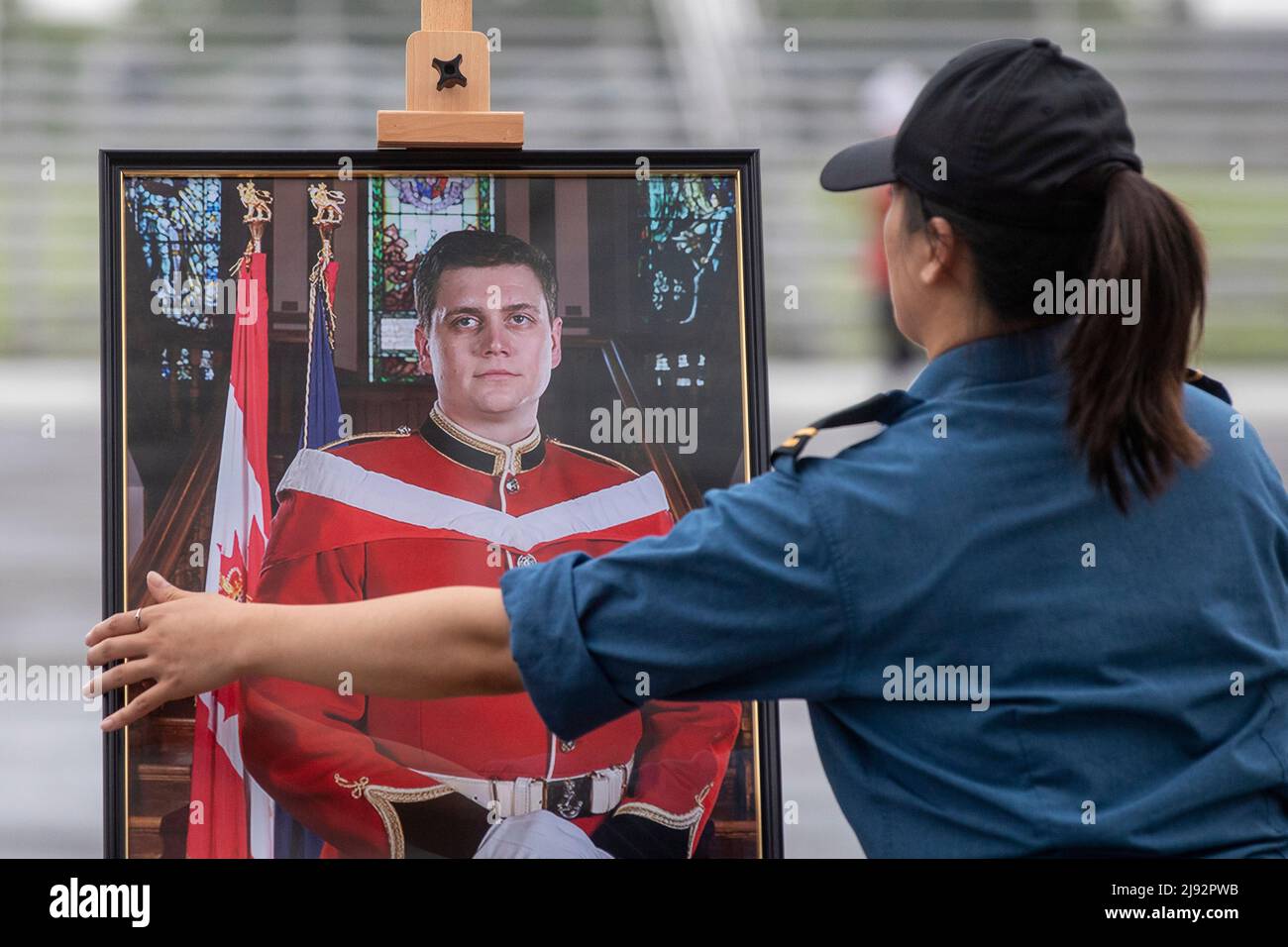 A picture of Officer Cadet Jack Hogarth is adjusted during a ...