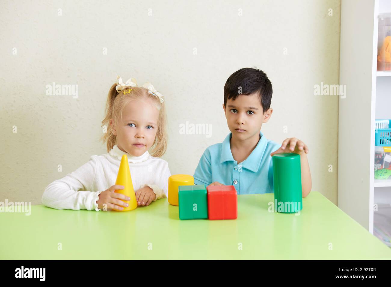 Sad lonely preschool children playing in kindergarten Stock Photo - Alamy