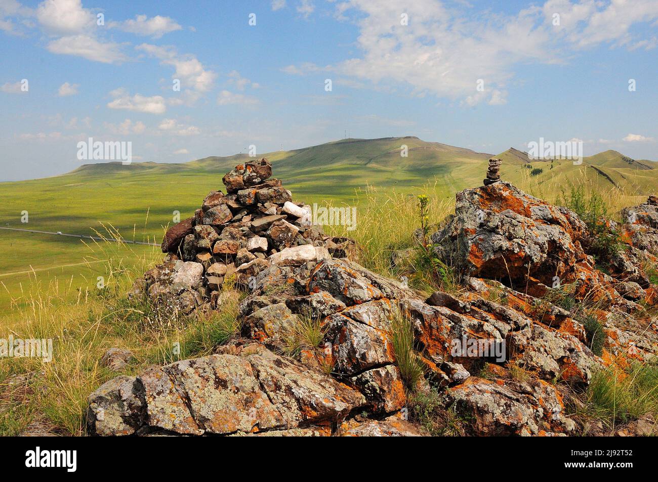 Ritual stone pyramids on top of a mountain overlooking the endless ...