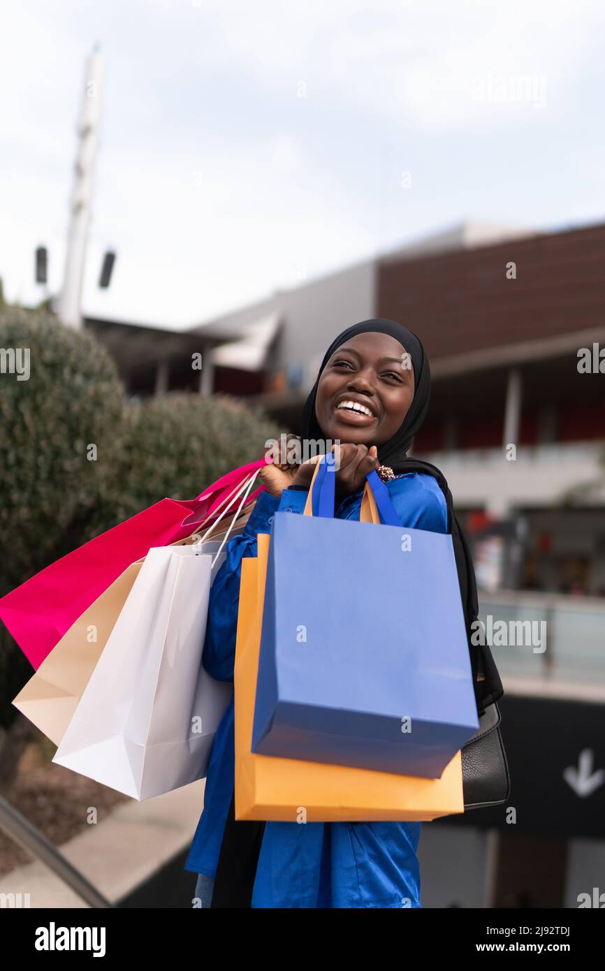 Excited black woman bags hi-res stock photography and images - Alamy