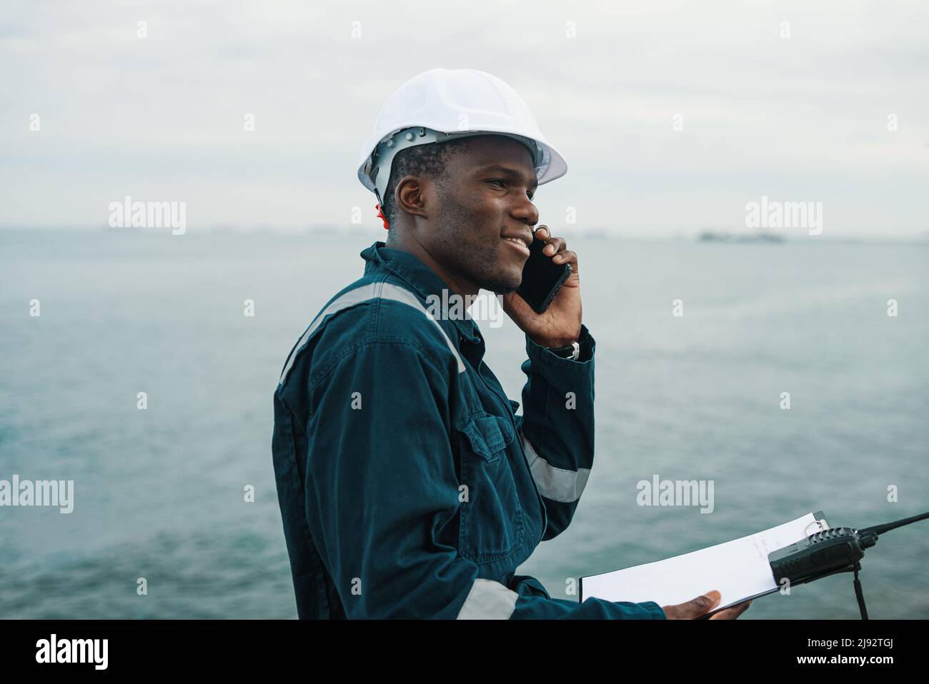 African American seaman speaking with family on cellphone Stock Photo ...