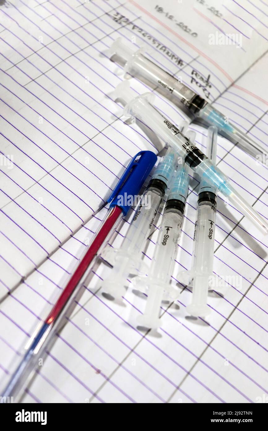 syringe stock on register book in hospital for vaccine pushing Stock ...