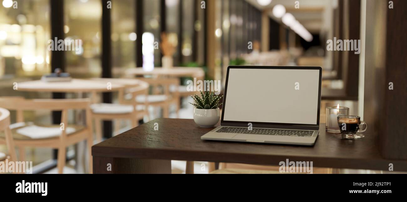 Modern comfortable coffee shop seating area interior design with laptop ...