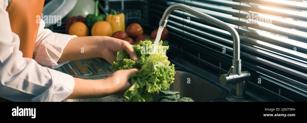 Asian hands woman washing vegetables salad and preparation healthy food ...
