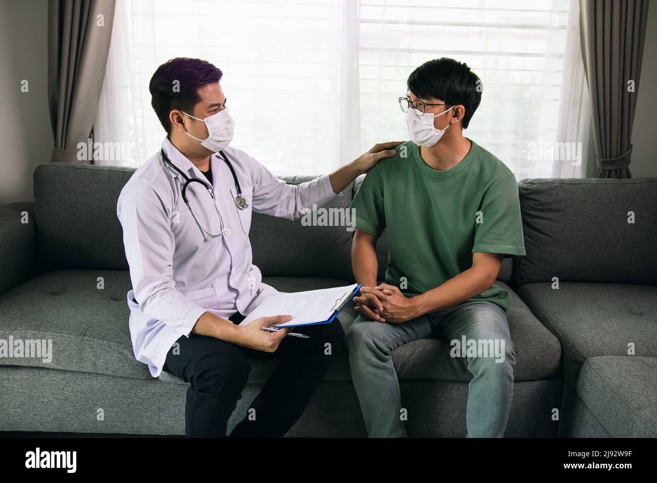 Doctor visit patients at home and follow-up the results treatment while ...