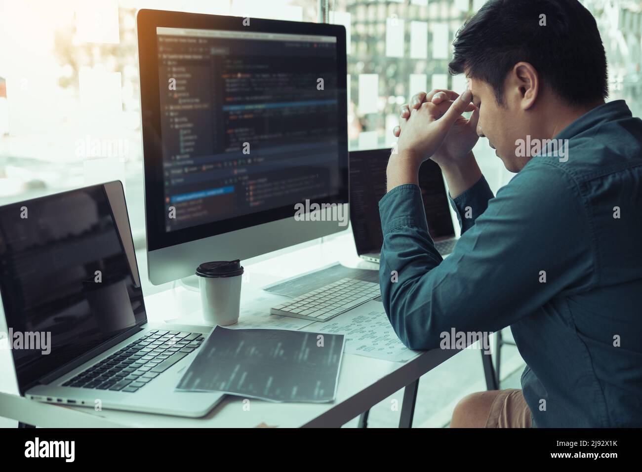 Software developers headache with code analysis in the office Stock ...