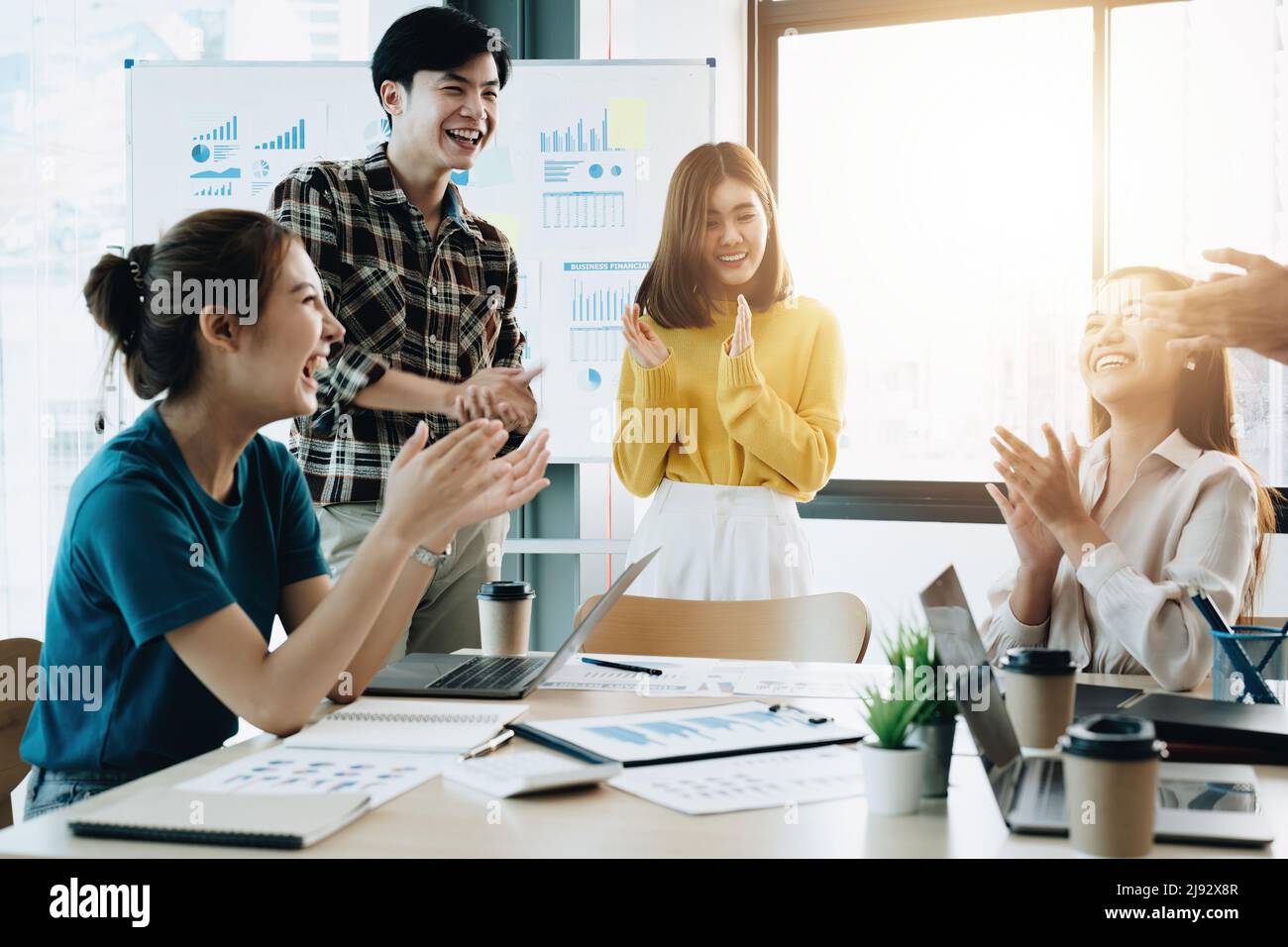 Group of young asian business people in smart casual wear working ...