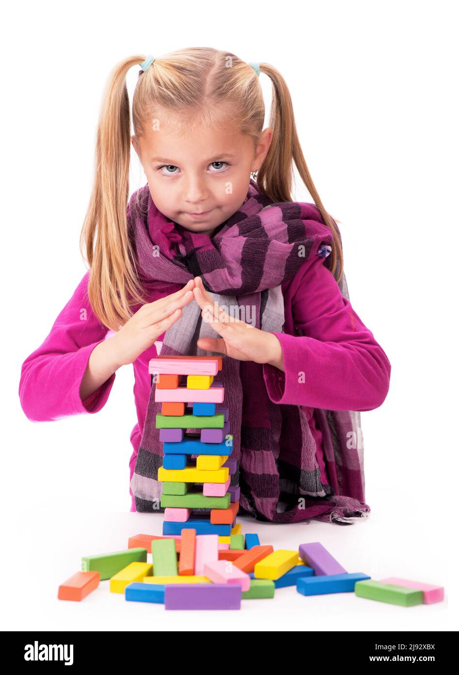 Children's hobbies, creativity, a little girl in a blue dress playing ...