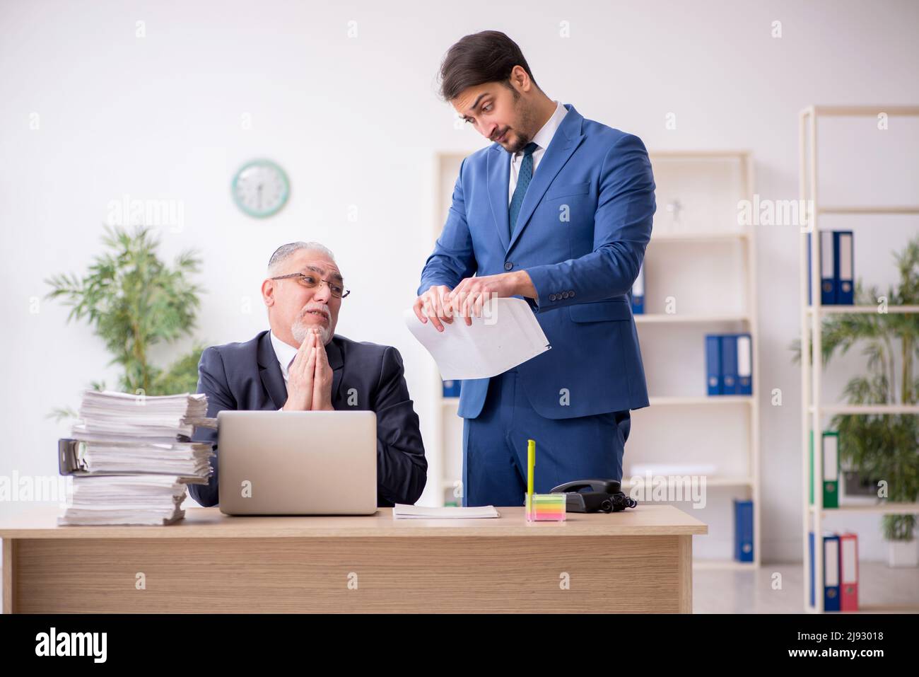 Two employees in dismissal concept Stock Photo - Alamy