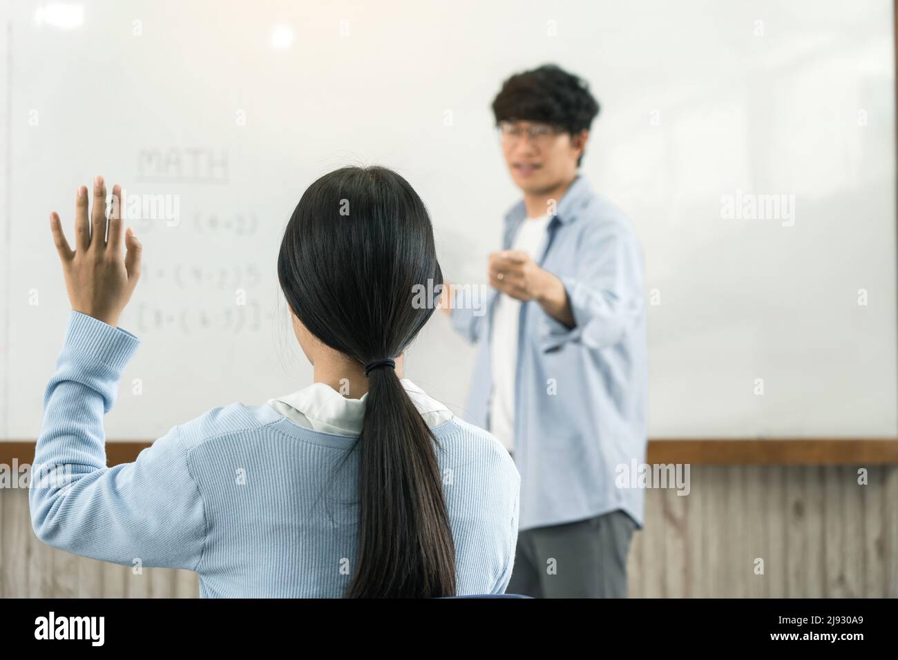 Asian male teacher teaching students at the classroom Stock Photo - Alamy