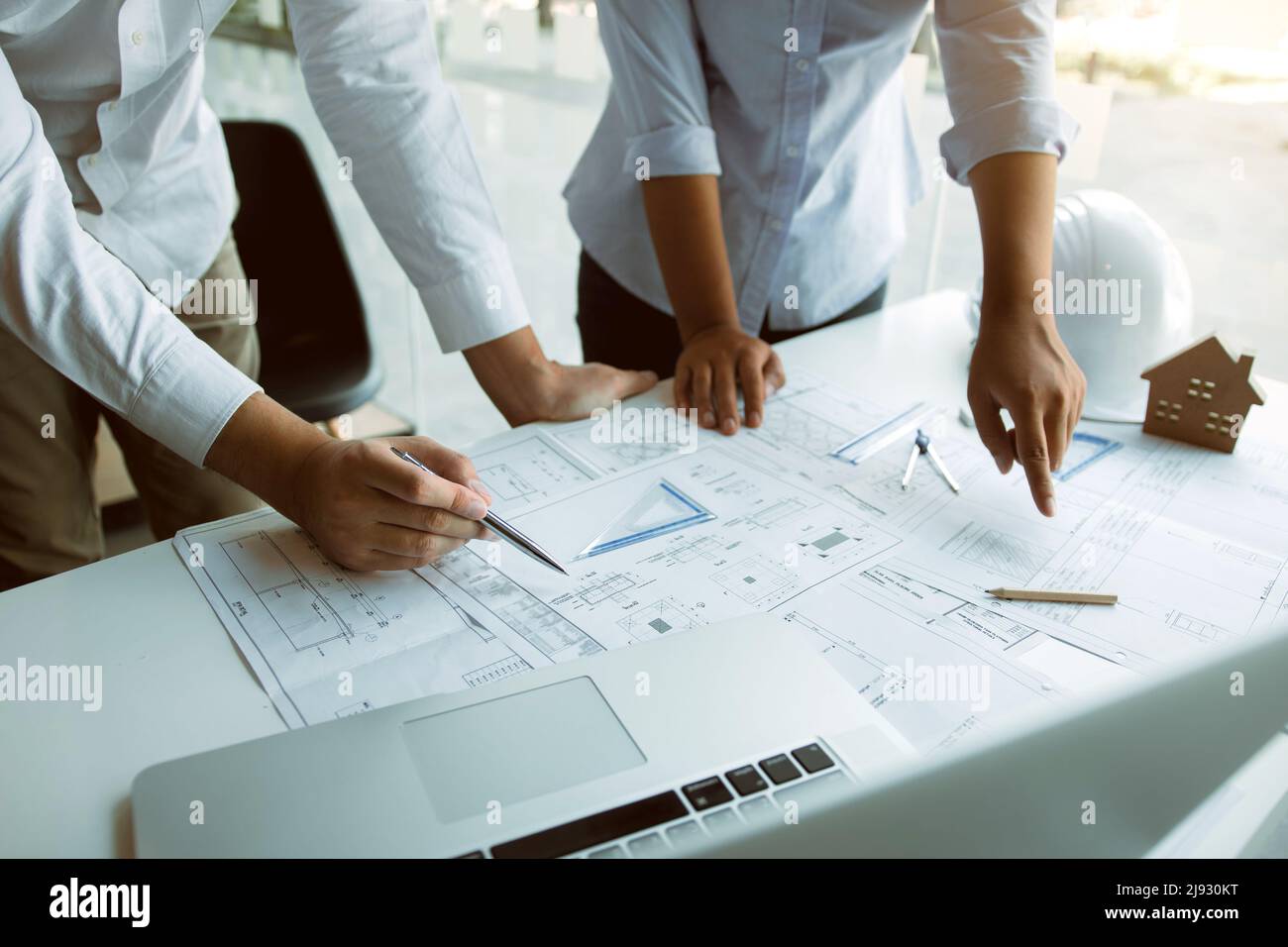 Structural engineering designers are working on the blueprints and ...