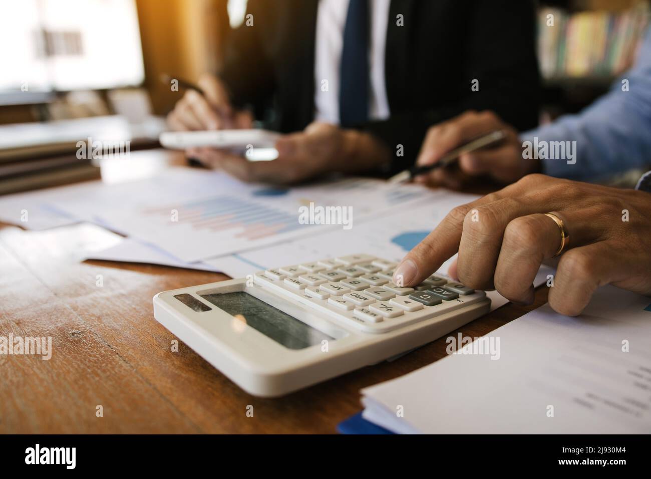 Two businessmen discussion analysis sharing calculations about the ...