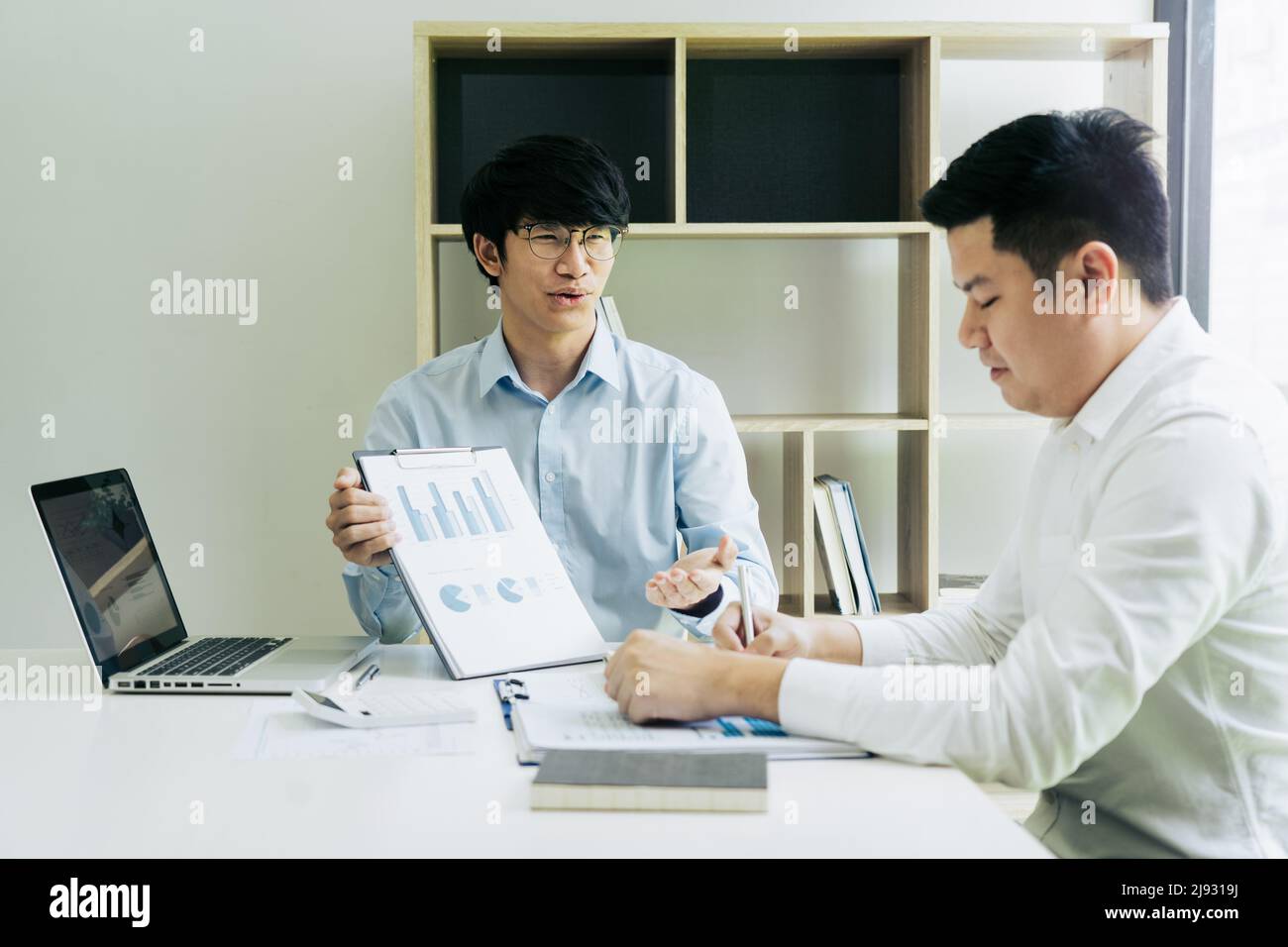 Businessman checking figures in hi-res stock photography and images - Alamy