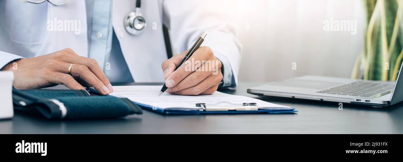 Serious illness doctor writing on hi-res stock photography and images ...
