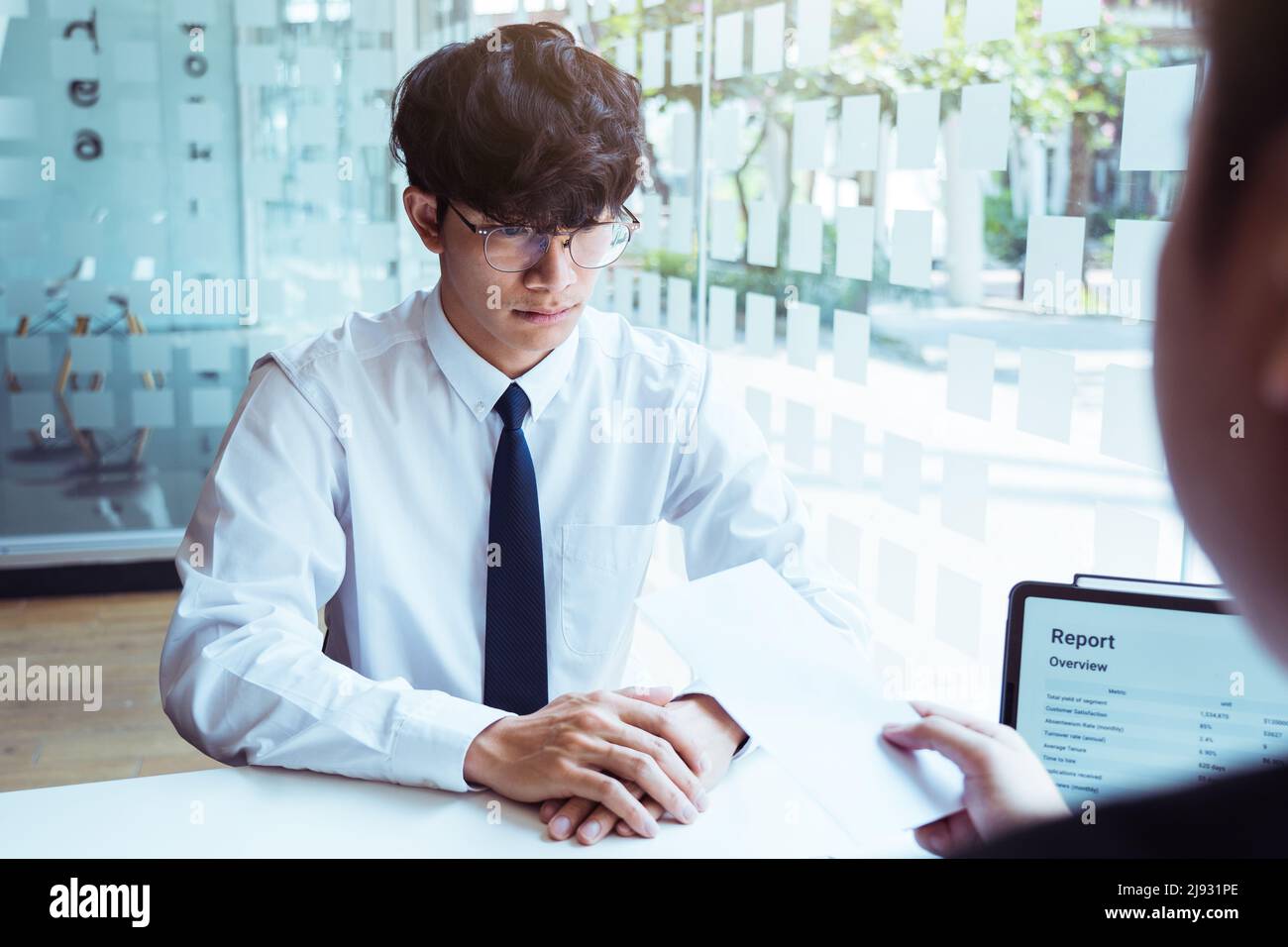 Male manager is talking or explaining about having to dismiss the ...