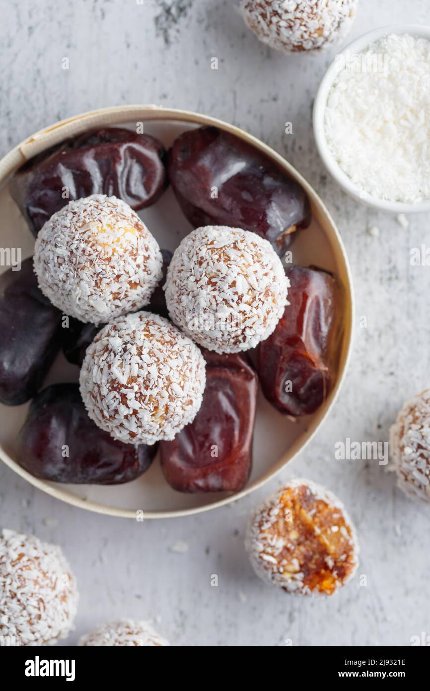 Homemade dates candies with coconut top view Stock Photo - Alamy