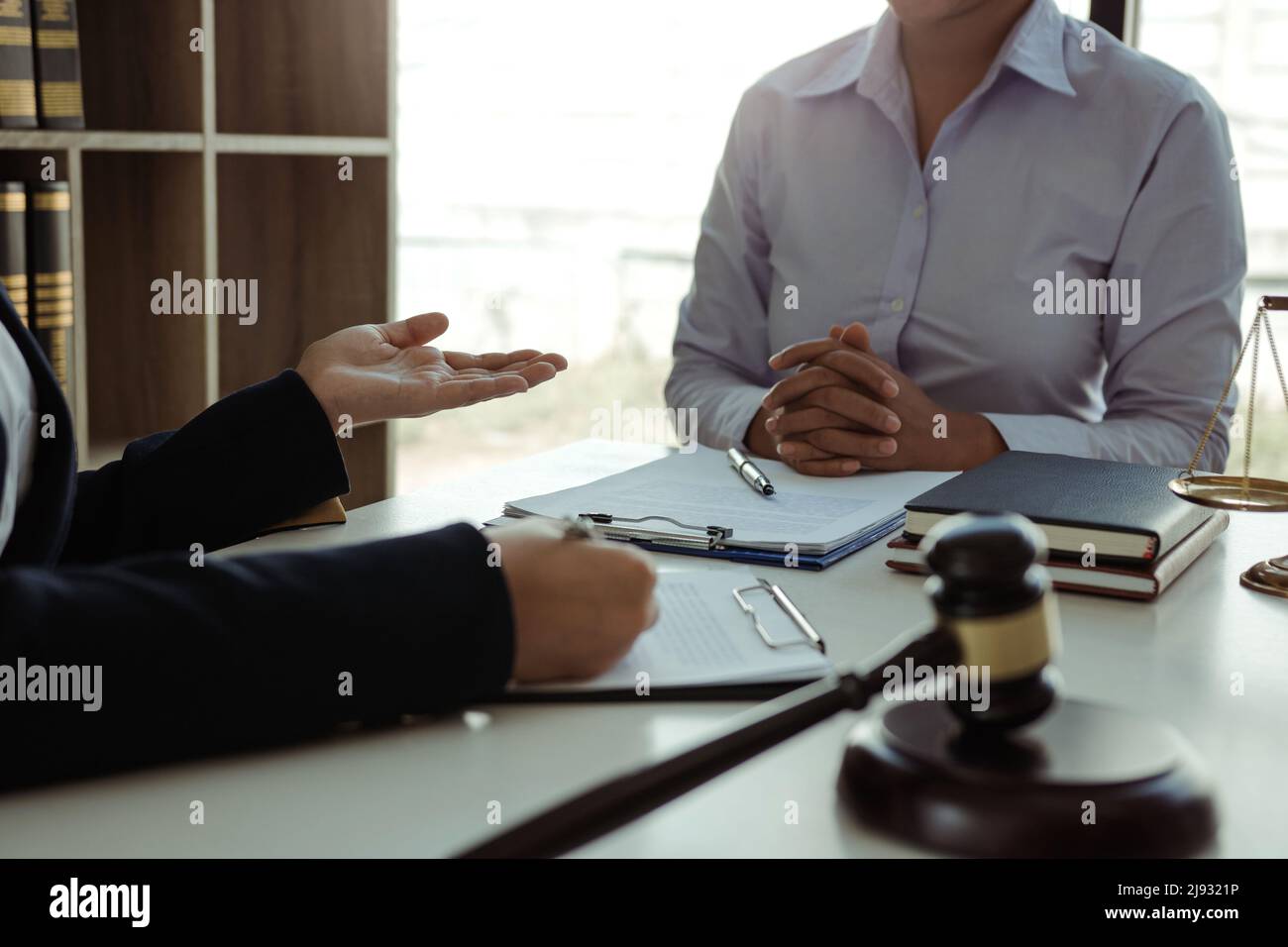 Lawyer is giving advice to clients who have consulted about legal ...