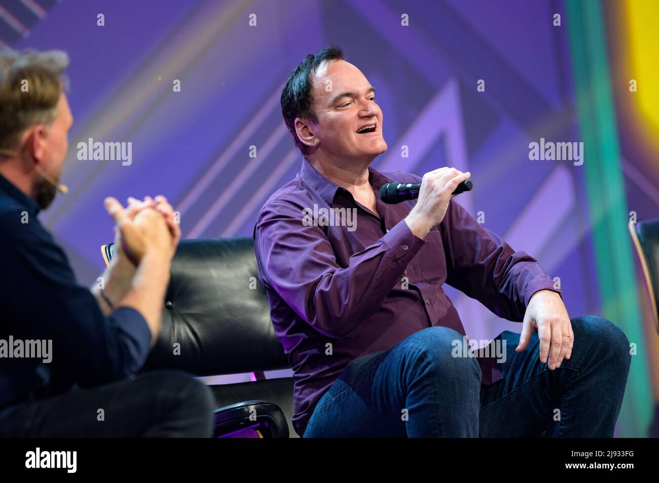 Hamburg, Germany. 18th May, 2022. Director Quentin Tarantino (M) reacts ...