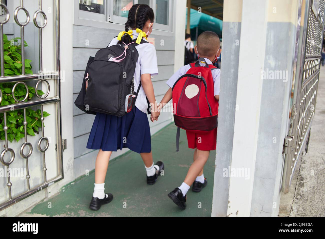 Group of kids going to school together Stock Photo - Alamy