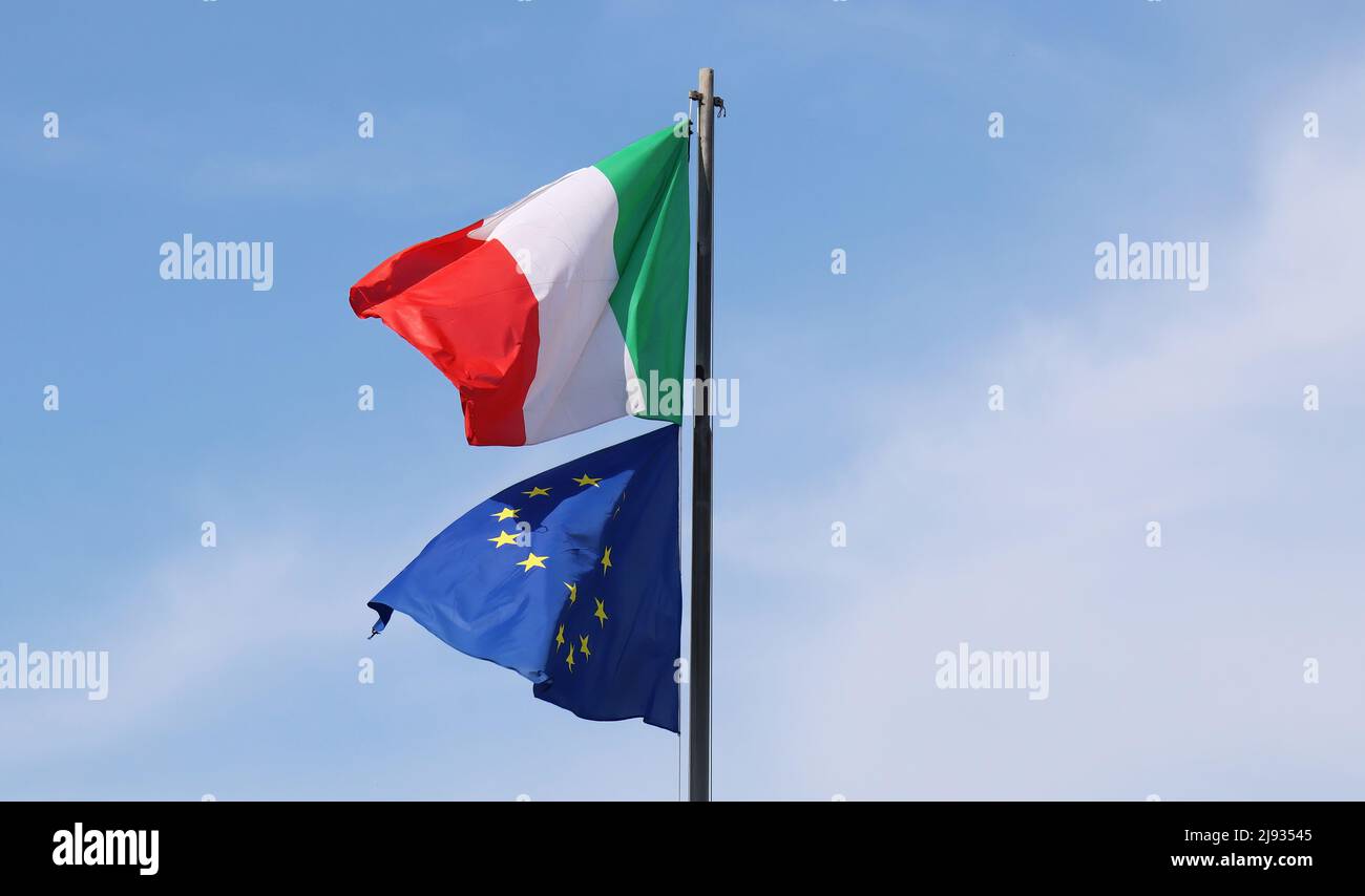 The Italian flag waves with the European Union flag Stock Photo - Alamy