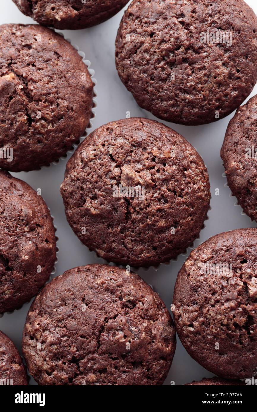 Pile of chocolate muffins on a white background Stock Photo - Alamy