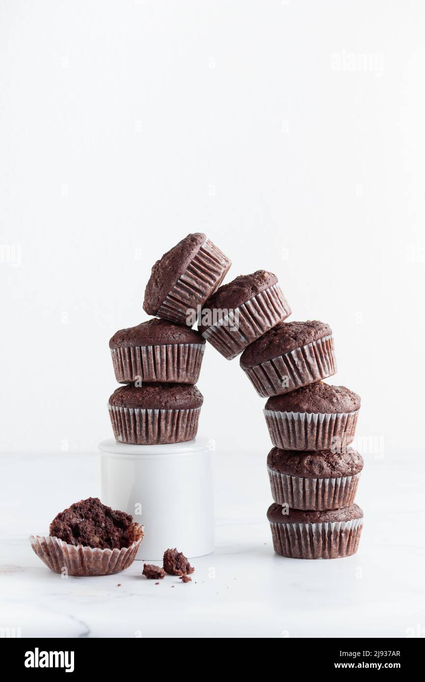 Pile of chocolate muffins on a white background Stock Photo - Alamy
