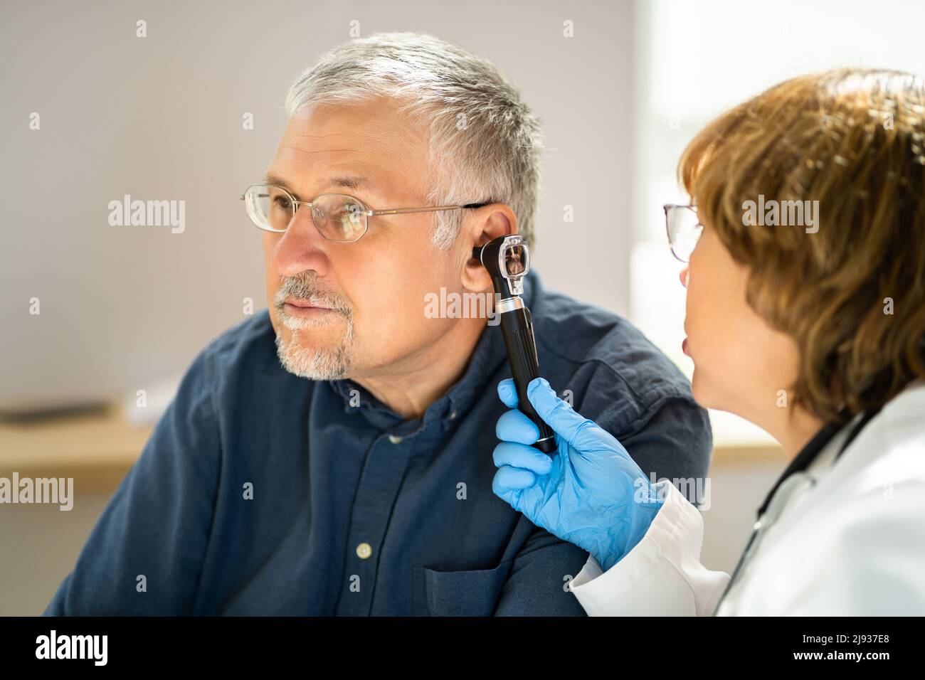 Otolaryngology Ear Check Using Otoscope. Doctor Examining Patient Stock ...