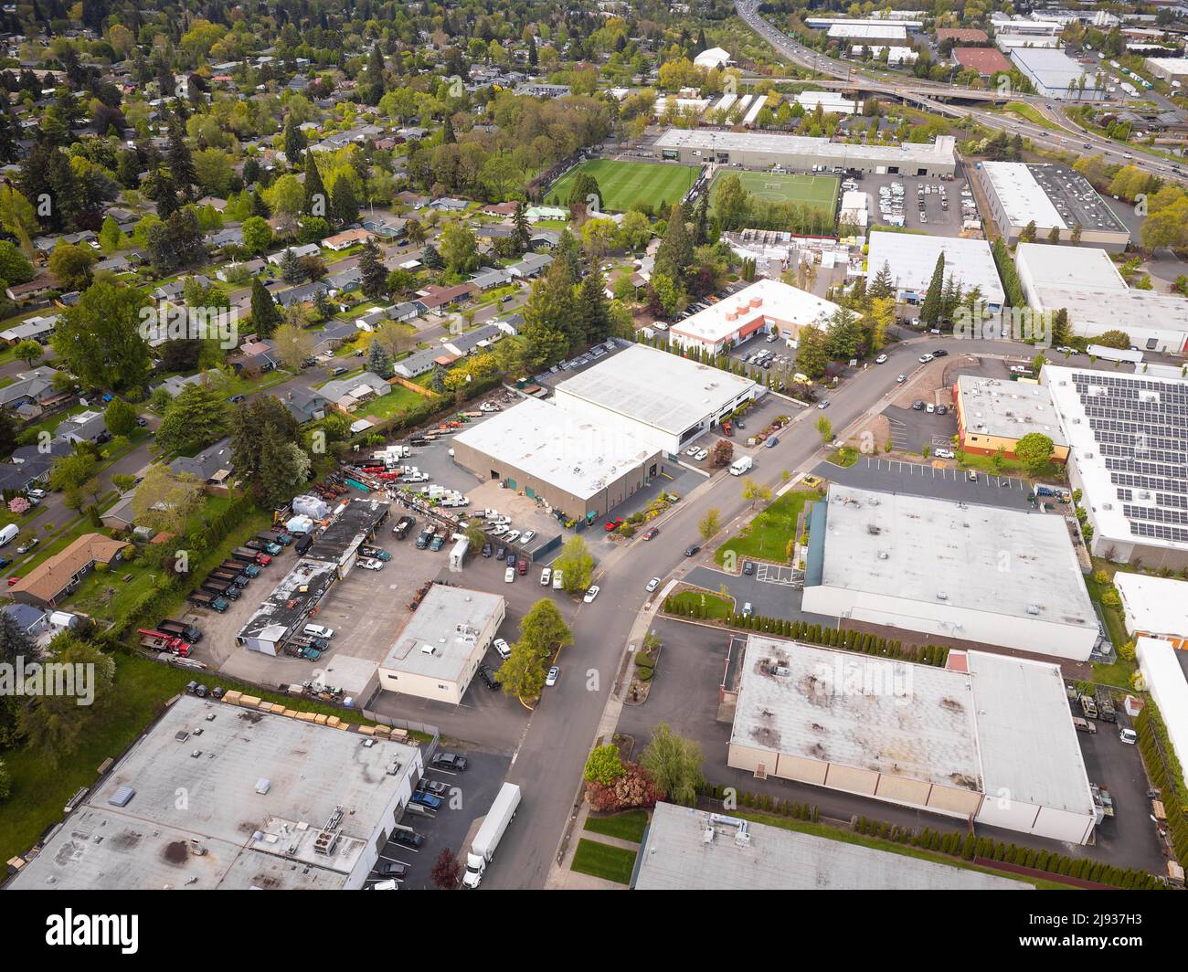 Shooting from a drone. A small city, a lot of greenery, paved walkways ...