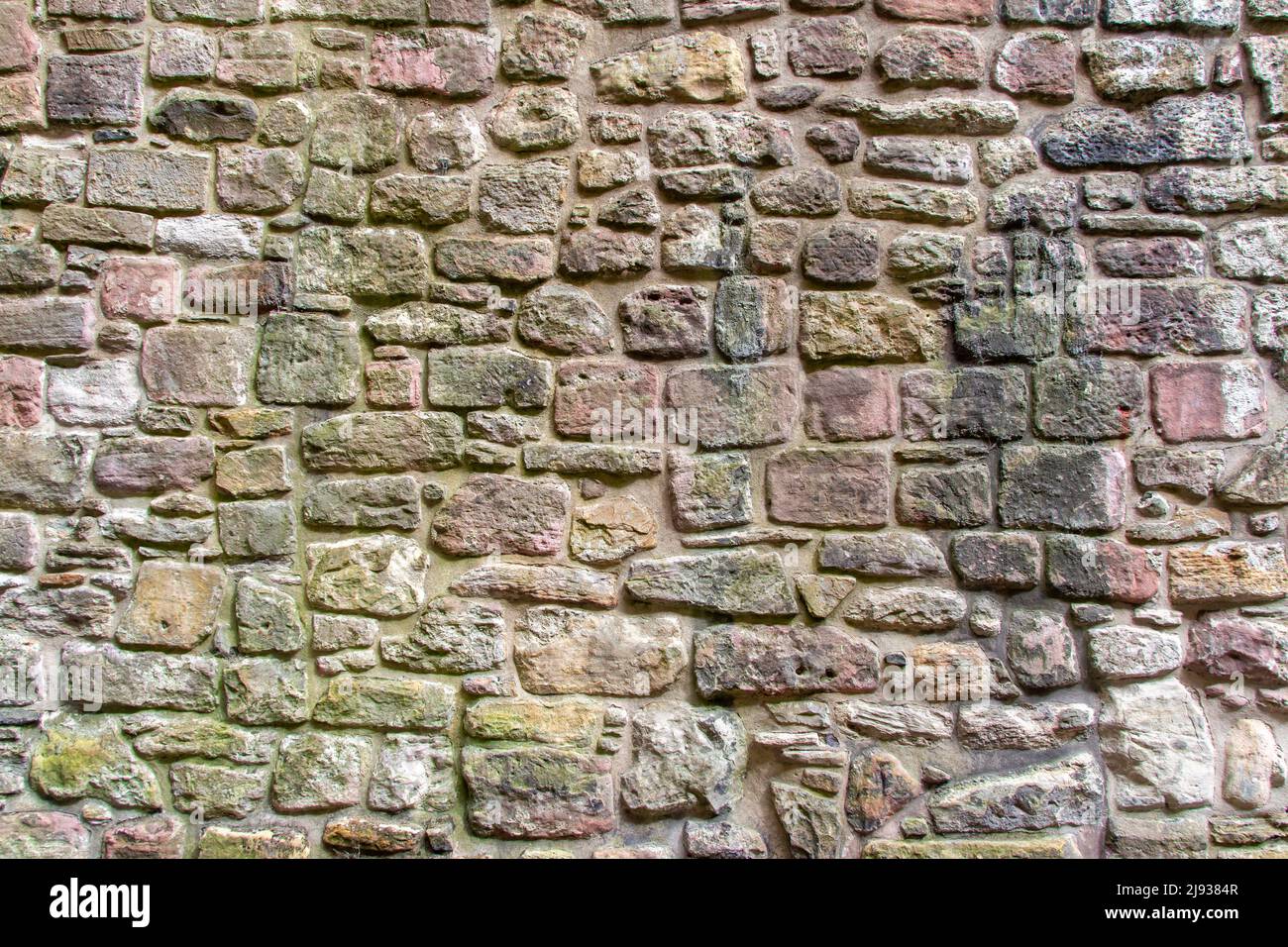 Beautiful old medieval European stone wall texture background, with ...