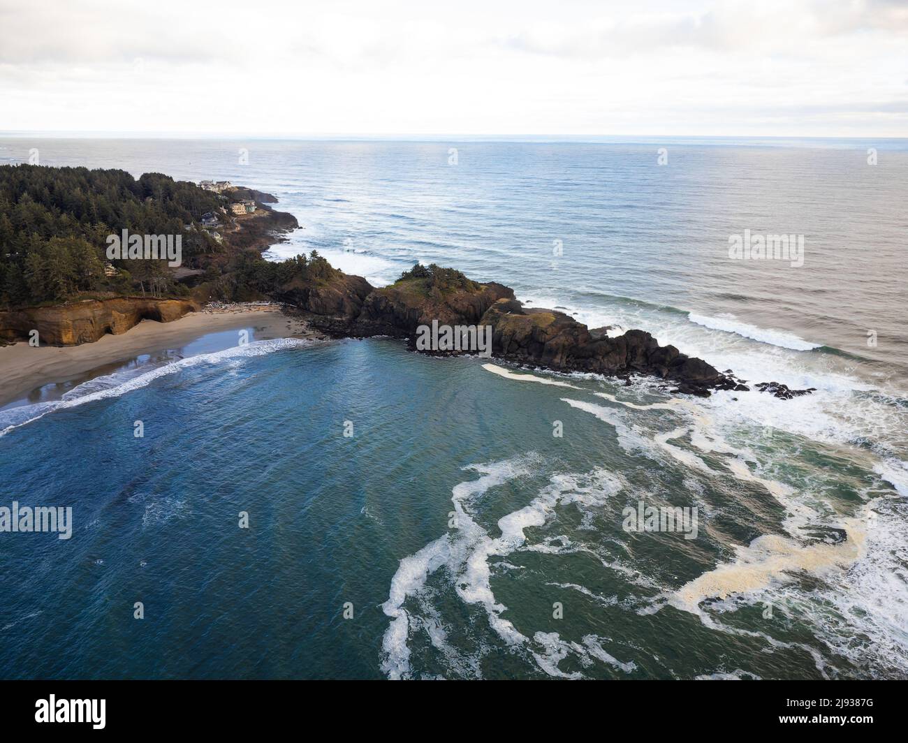 Beautiful seascape. Dark blue ocean water with white foamy waves, rocky ...