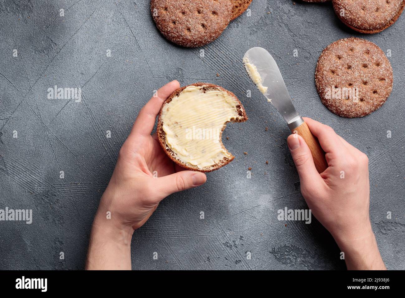 Ruisleipa - traditional Finnish rye bread with butter on a gray ...