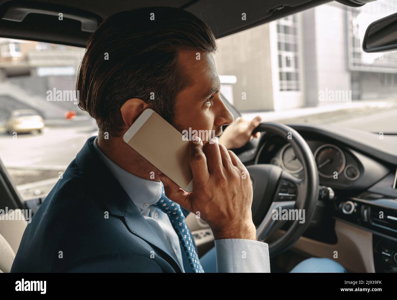 Confident business man having conversation on smartphone during the ...