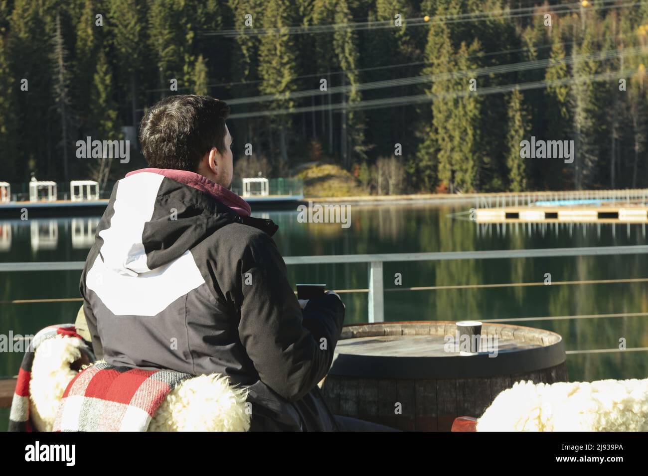 Man sitting and relaxing outdoor in resort Stock Photo - Alamy