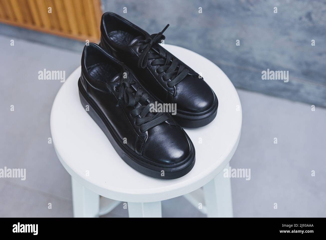 Black leather classic sneakers with laces. Casual women's style. Black ...