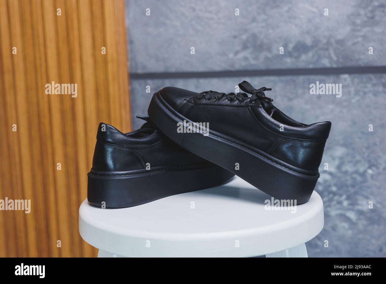 Black leather classic sneakers with laces. Casual women's style. Black ...