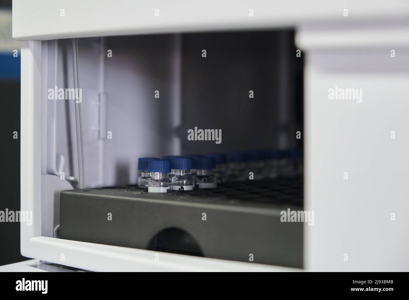 Vials with sample into autosampler of HPLC system ready to be analyzed ...