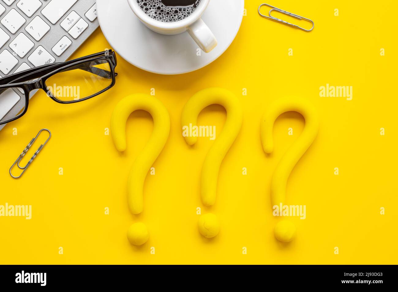 Question mark signs on office table. Customer support servise or FAQ ...