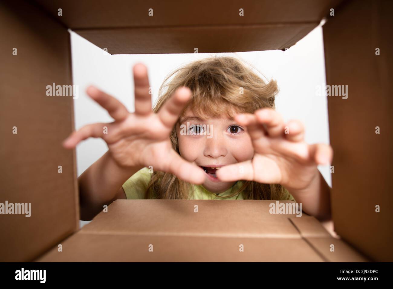 Unpacking cardboard box for kids. Child open carton delivery box ...
