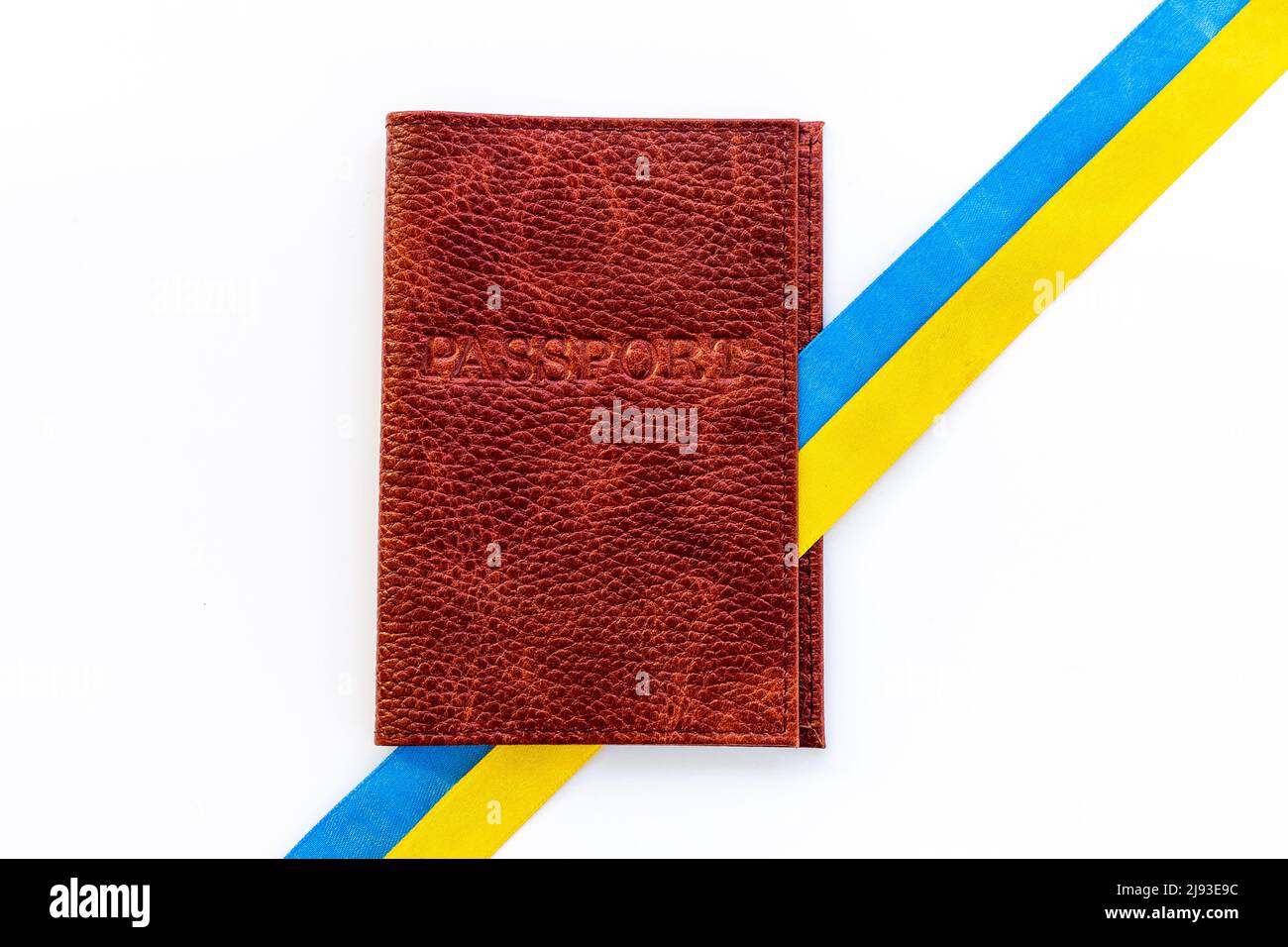 Yellow and blue ribbon with passport. Ukrainian immigration concept ...