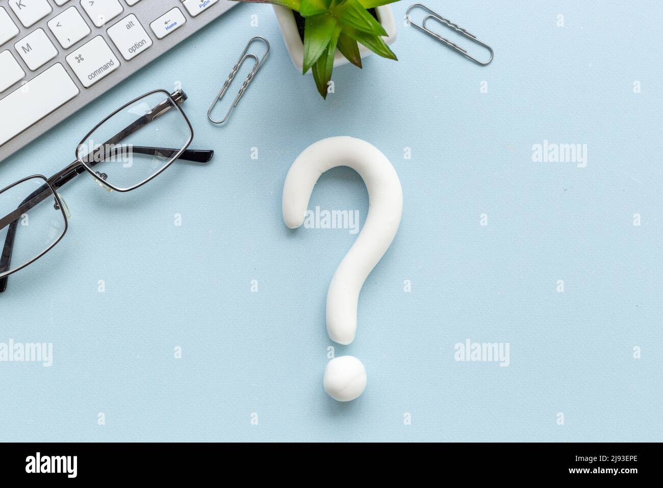 Question mark symbol on office desk. Solving problem or search solution ...