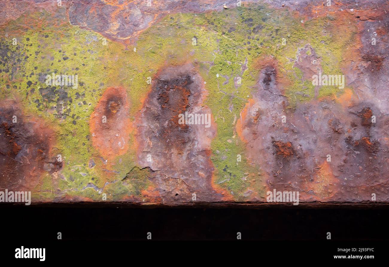 Different colours and textures of rust and corrosion on a metal beam ...